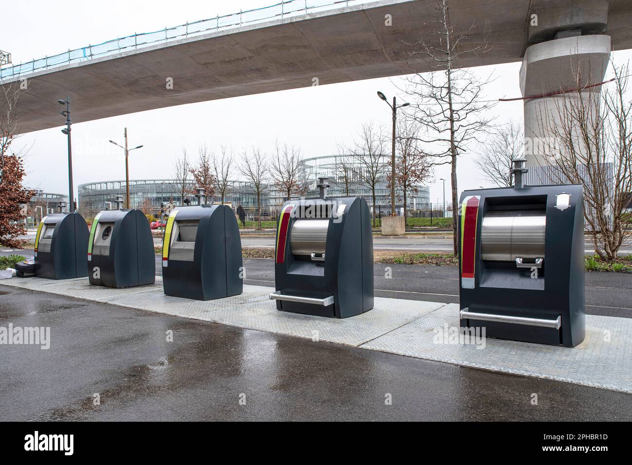 Recycling bins on the pavement of an urban landscape in the city Stock ...