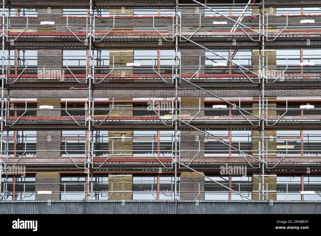 Thermal insulation of a building from the outside with scaffolding ...