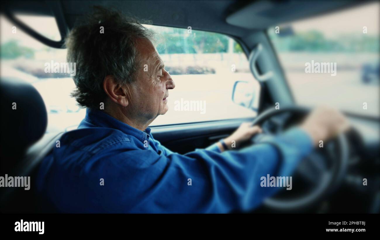One senior man drives car. Older mature person driving moving vehicle ...