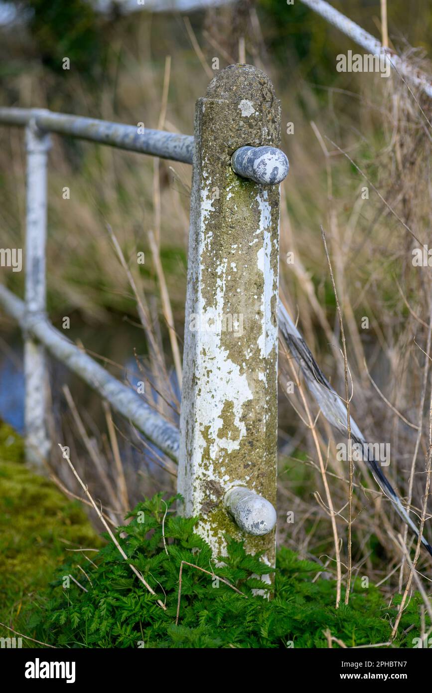 Concrete post with metal rails Stock Photo - Alamy