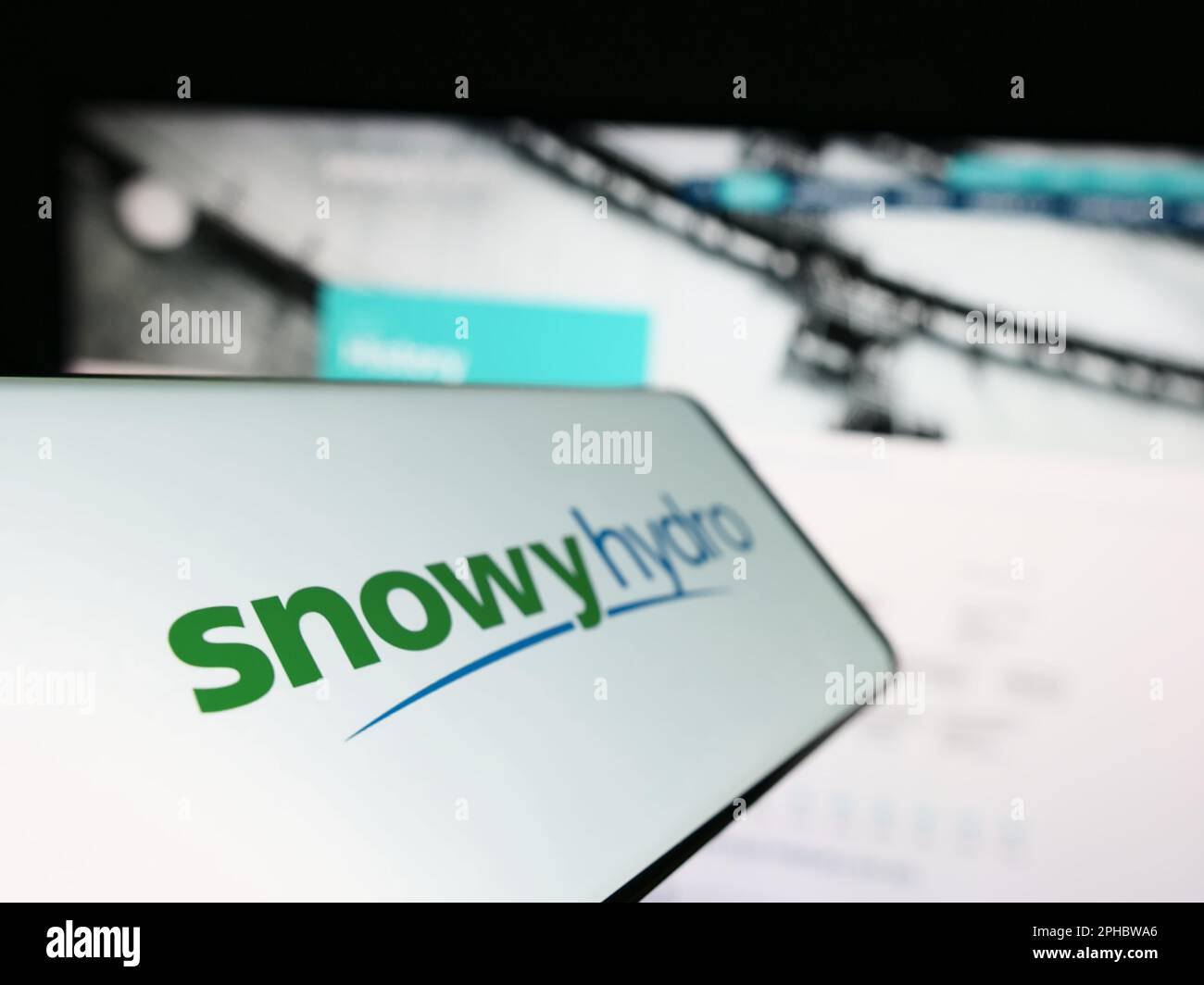 Mobile phone with logo of Australian energy company Snowy Hydro Limited ...