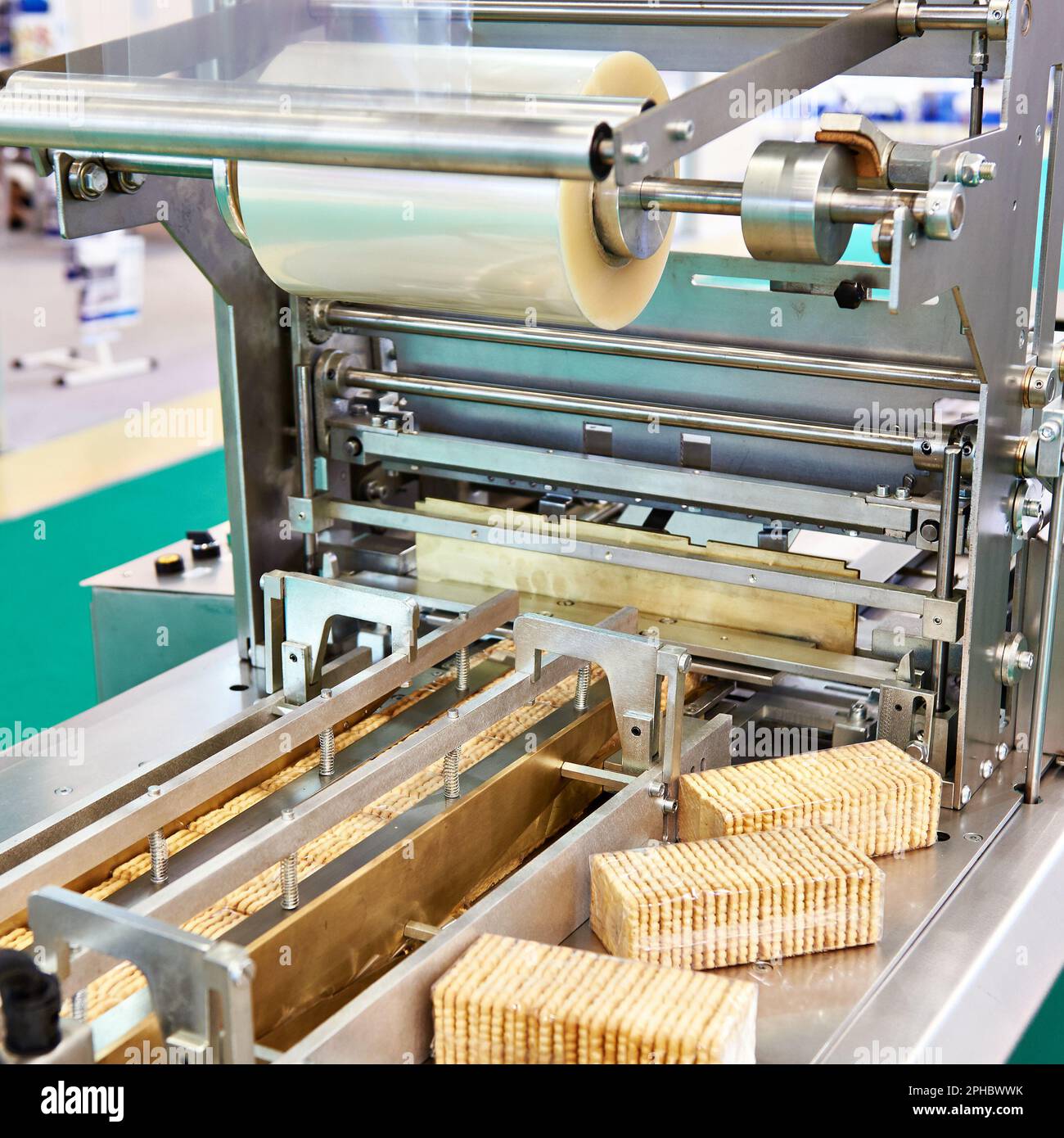 Machine for packaging biscuits on food plant Stock Photo - Alamy