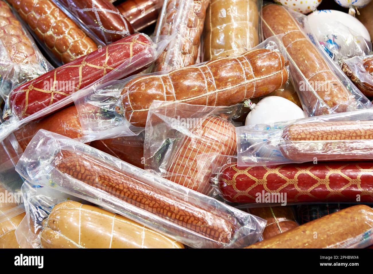 Pile of sausages in plastic vacuum packs Stock Photo - Alamy