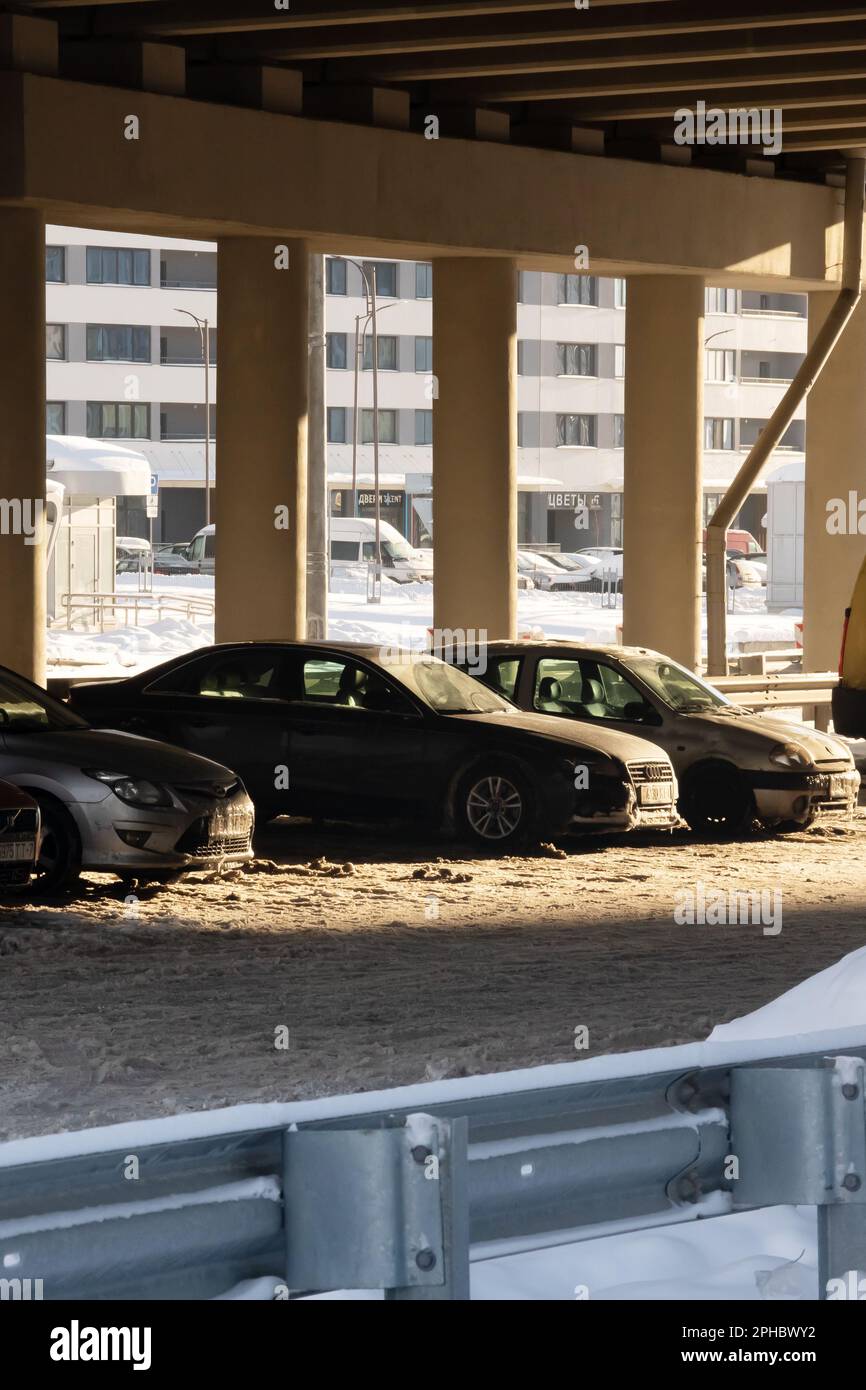Belarus, Minsk - 12 december, 2022: Cars parked under the bridge Stock ...