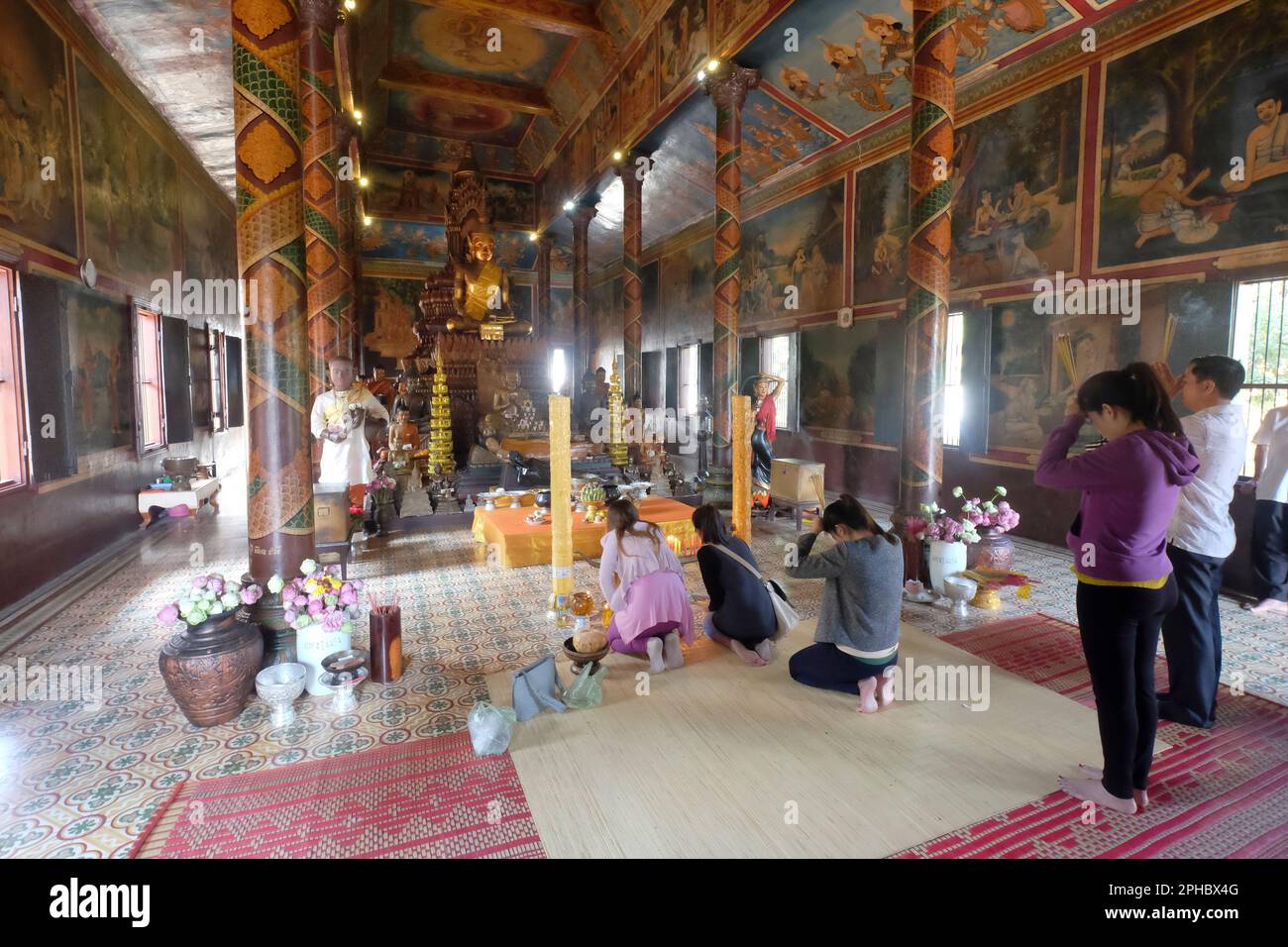 People worship at Wat Phnom Hill Buddhist temple the throne room inside ...