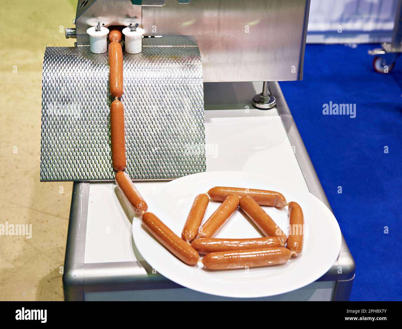 Sausage plastic packing machine in store Stock Photo - Alamy