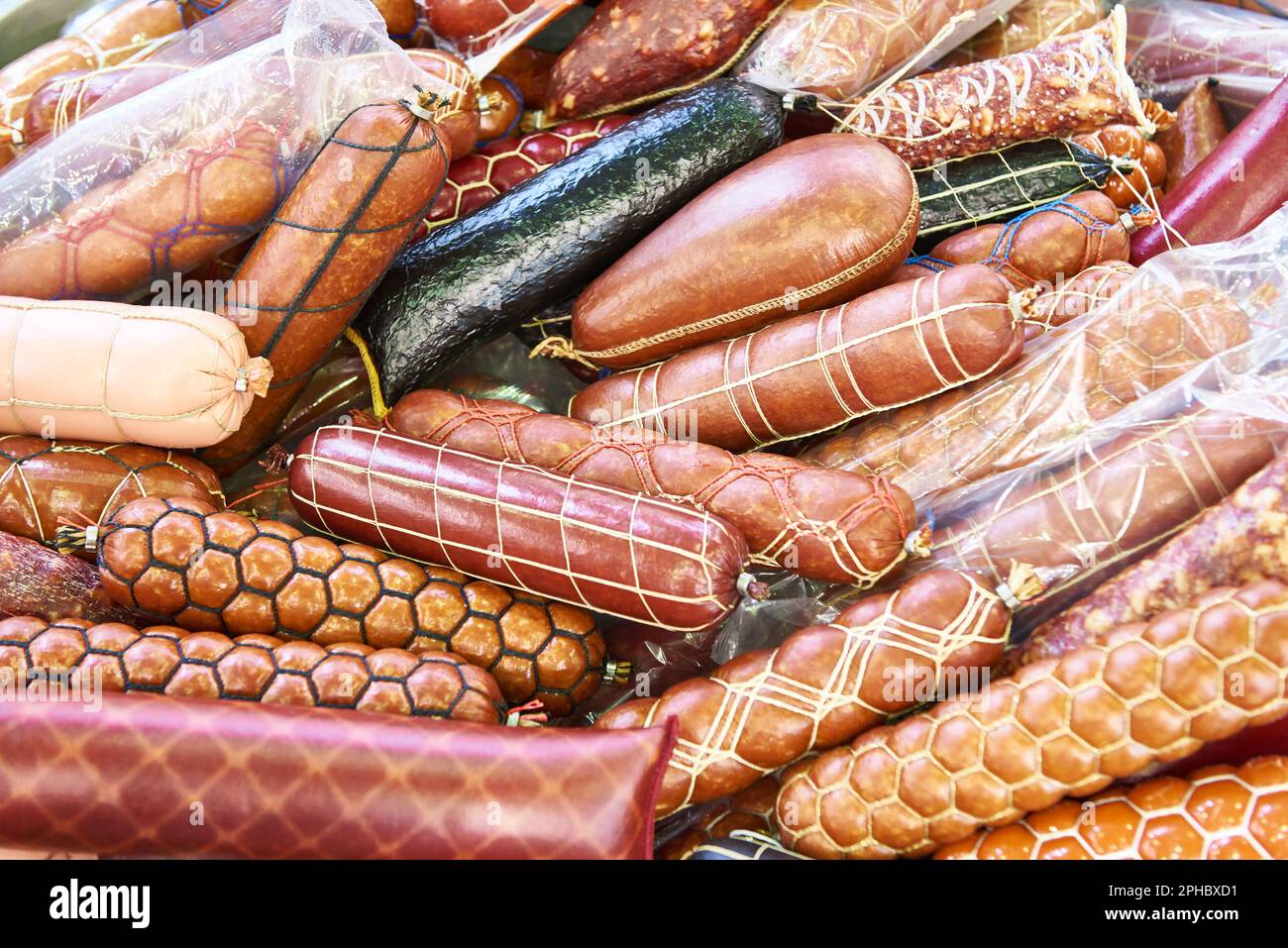 Pile of sausages in plastic vacuum packs at market Stock Photo - Alamy