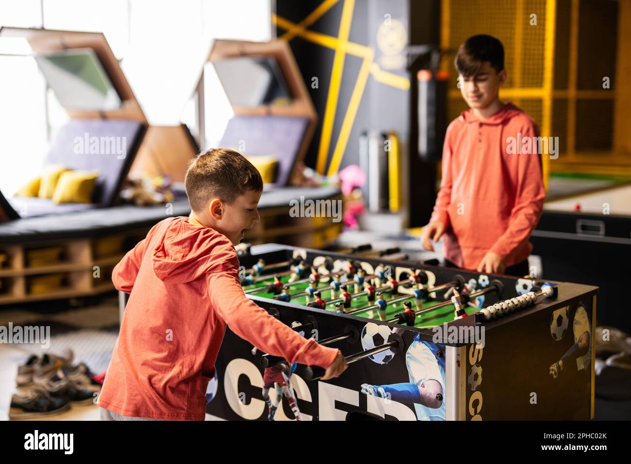 Kids playing soccer in room hi-res stock photography and images - Alamy
