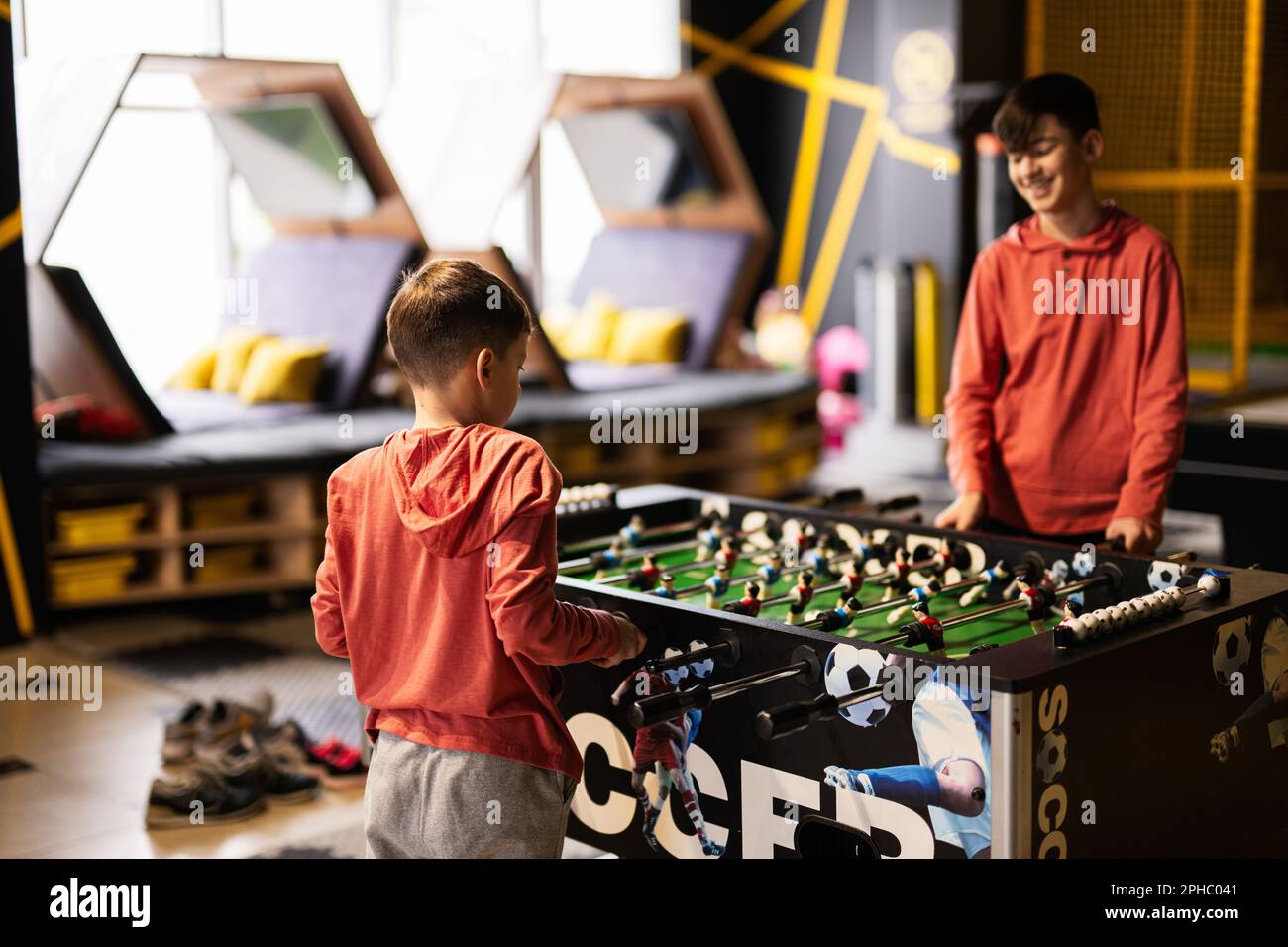 Kids playing soccer in room hi-res stock photography and images - Alamy