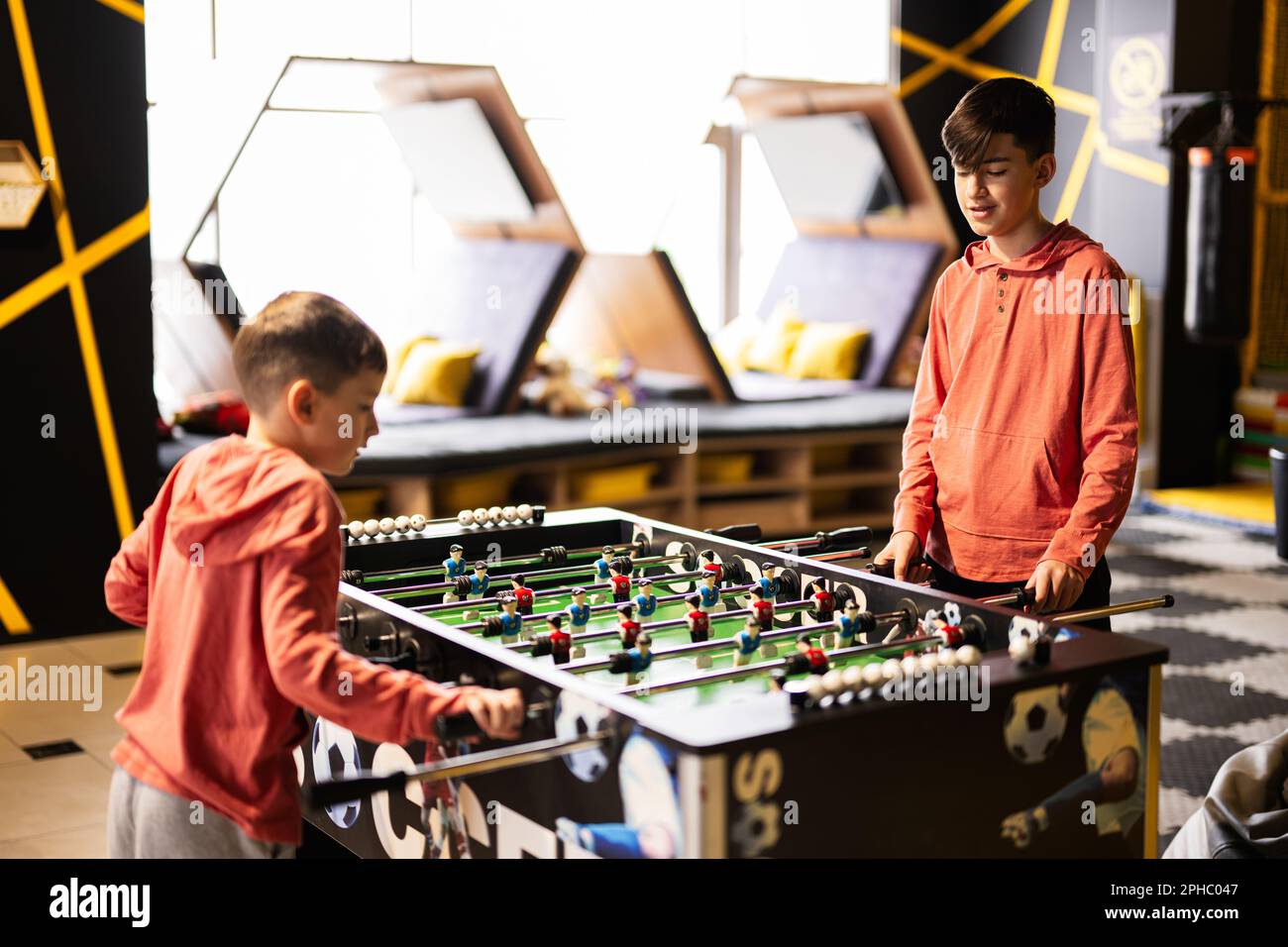 Kids playing soccer in room hi-res stock photography and images - Alamy