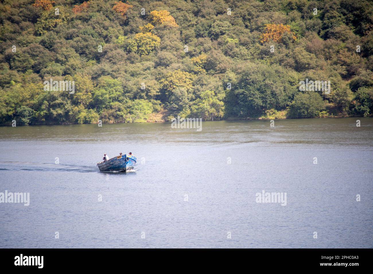 aerial drone shot of handmade boat used by rural villagers to cross ...