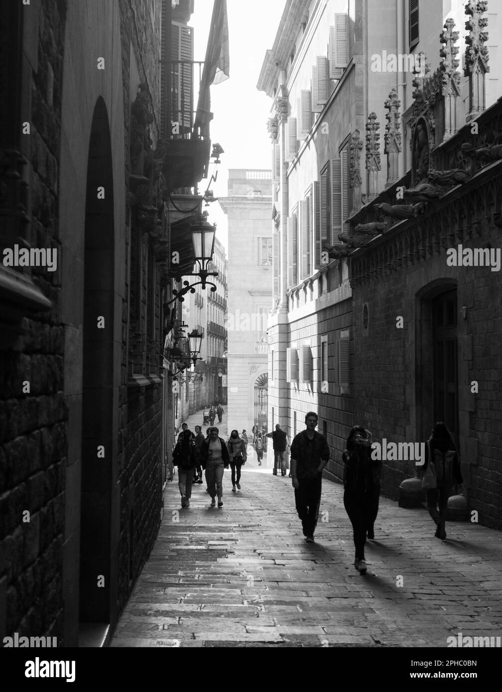 Walking into the sun city street Black and White Stock Photos & Images ...