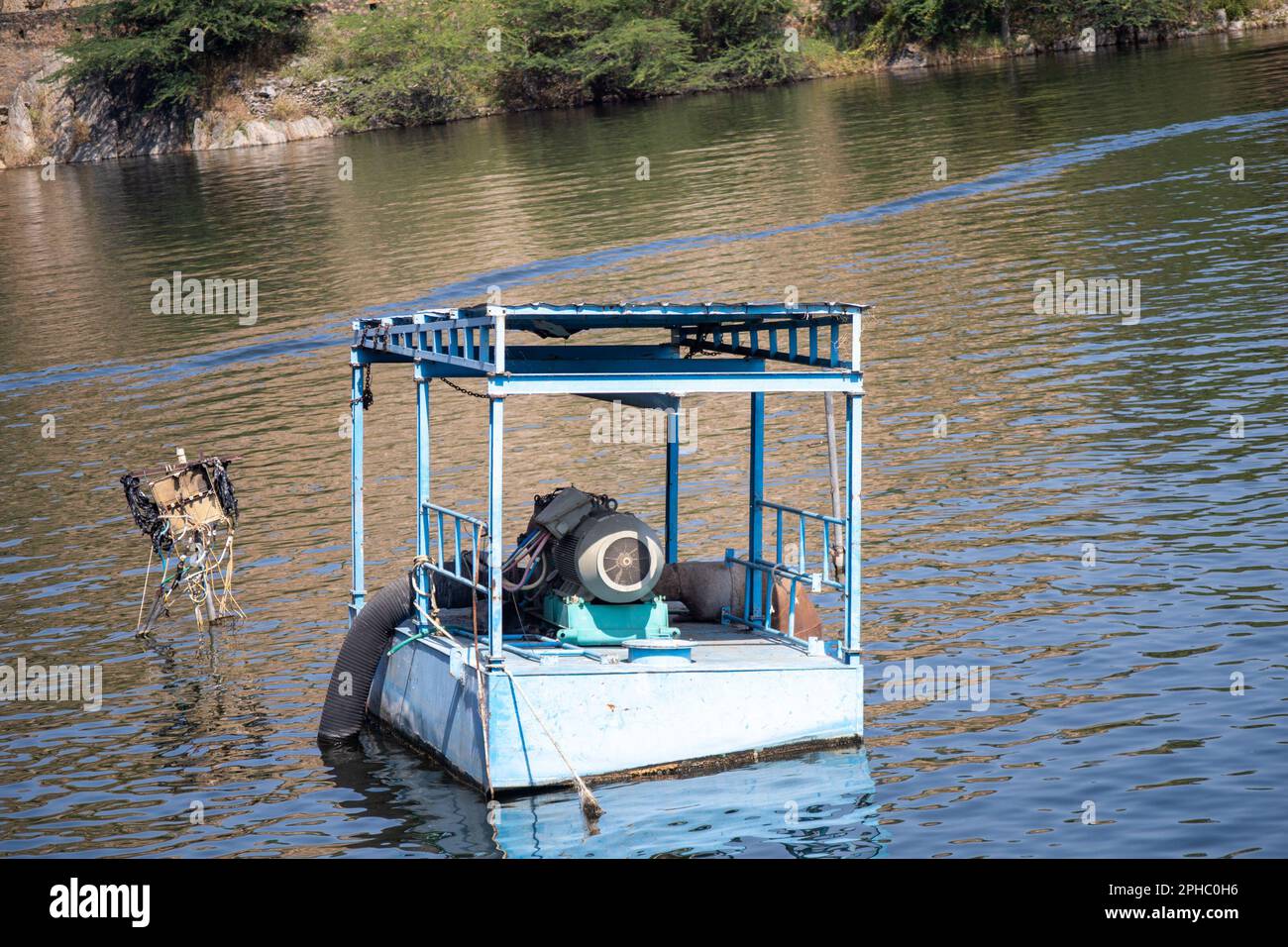floating generator pump on water on dhebar lake jaisamand showing local ...