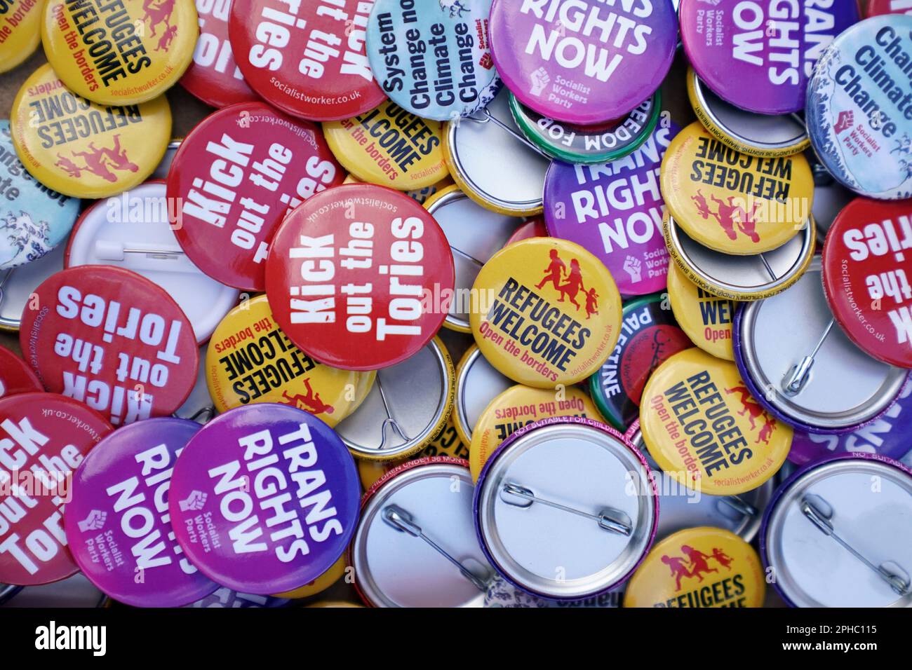 A collection of pin badges as demonstrators take part in a protest ...