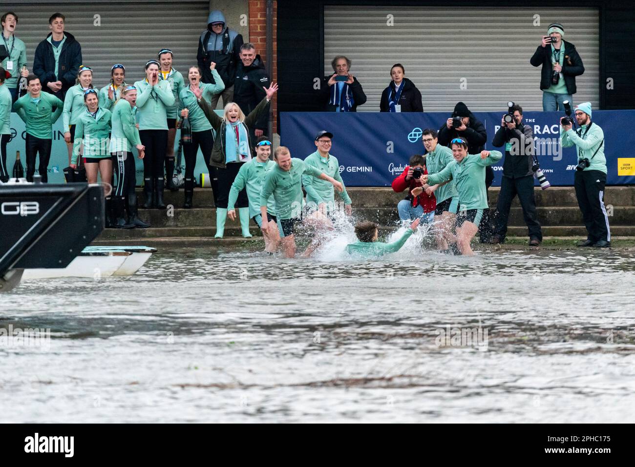 Boat Race 2023. Cambridge Men's cox Jasper Parish being thrown by team ...