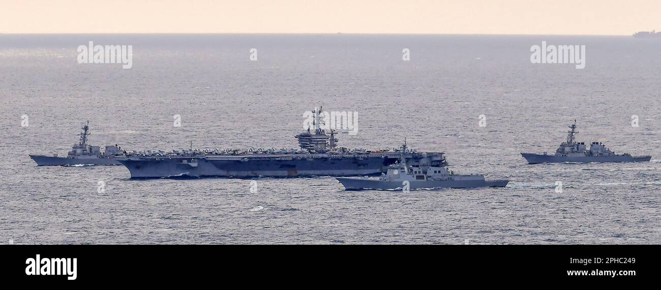 Busan, South Korea. 27th Mar, 2023. Members of the US Navy stand on ...
