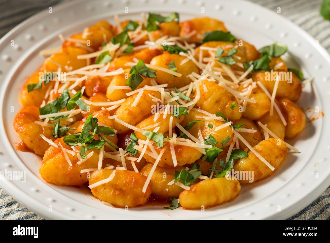 Homemade Italian Tomato Gnocchi Pasta with Cheese and Basil Stock Photo ...