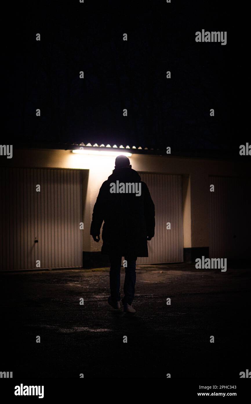 Person in the dark Stock Photo - Alamy