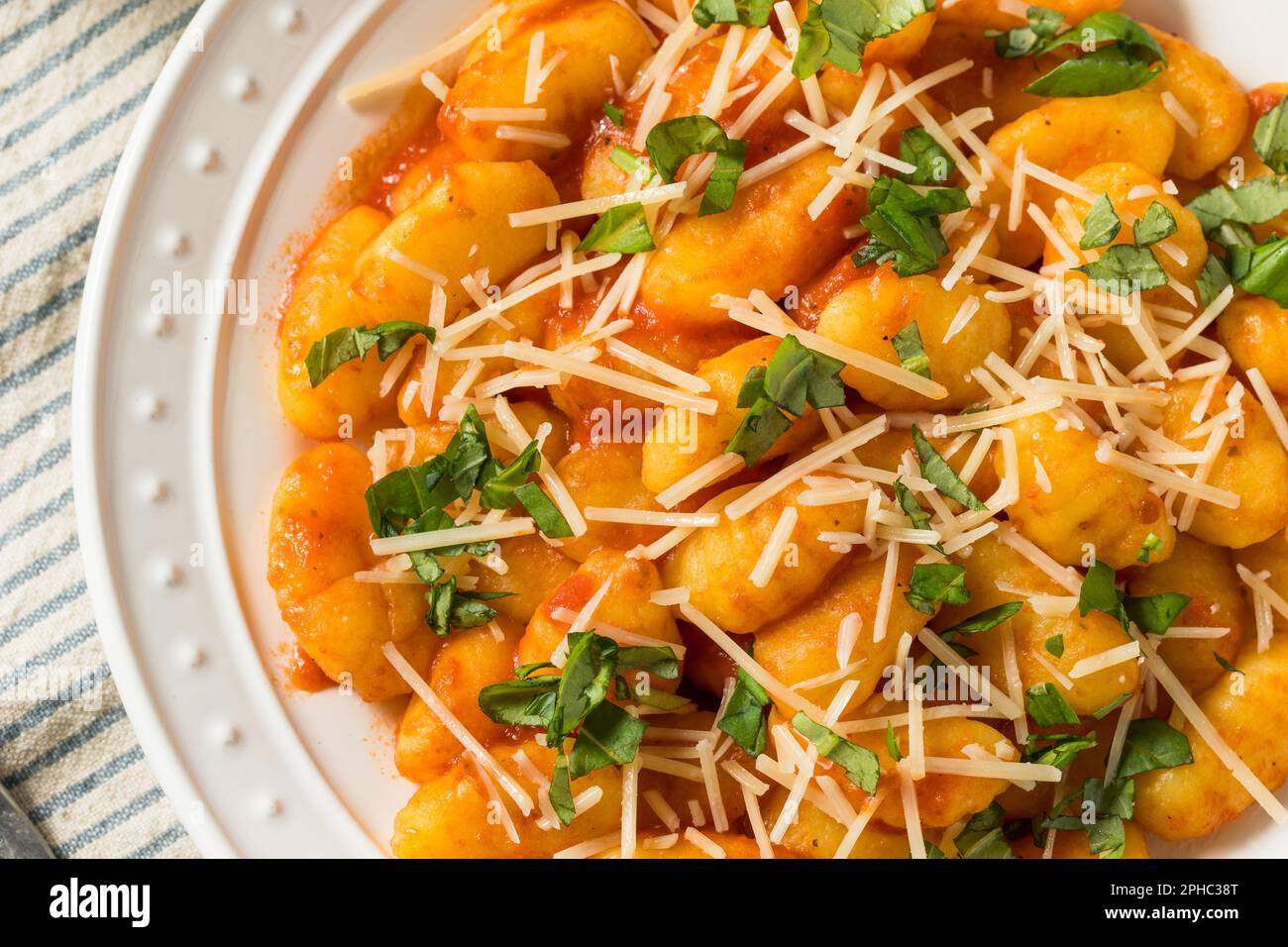 Homemade Italian Tomato Gnocchi Pasta with Cheese and Basil Stock Photo ...