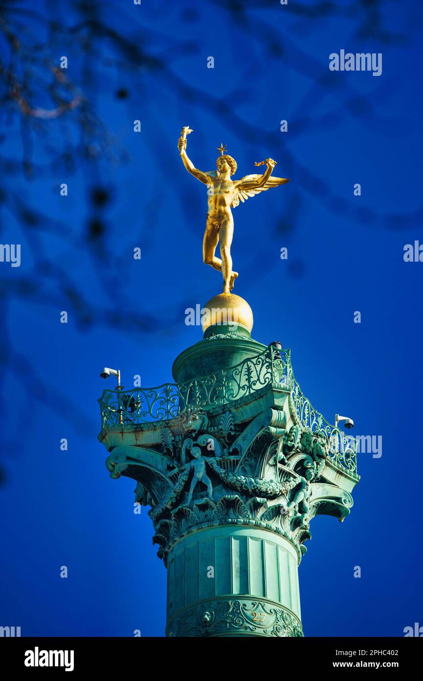 A golden statue atop the July Column in the Place de la Bastille in ...