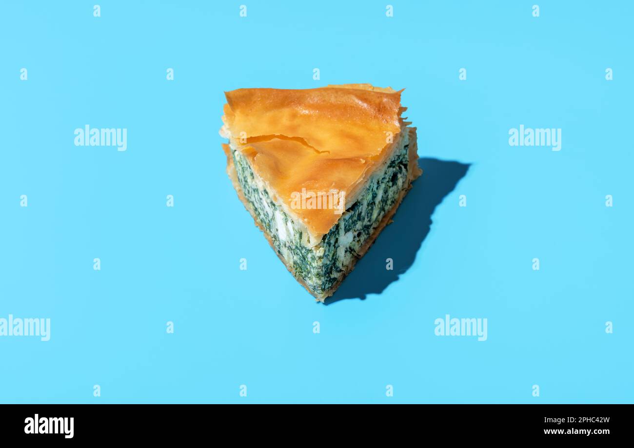 Single slice of phyllo cake, filled with spinach and feta cheese ...