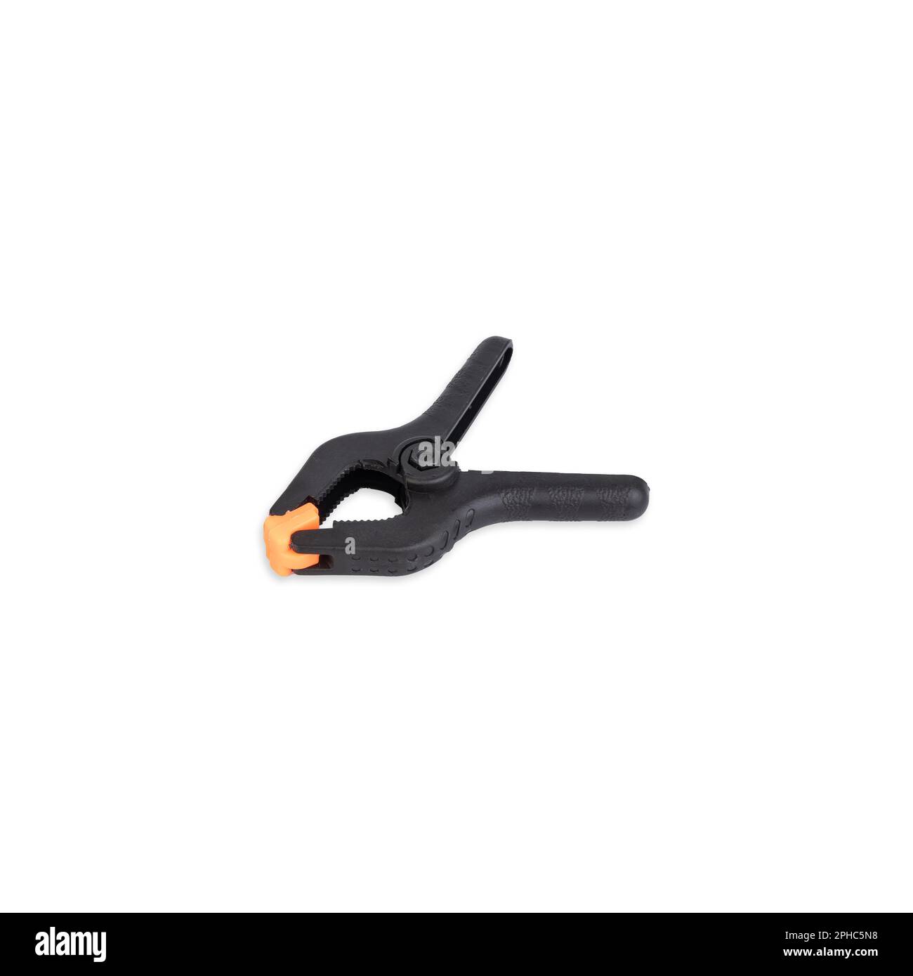 Plastic black and orange spring clamp isolated over white background ...