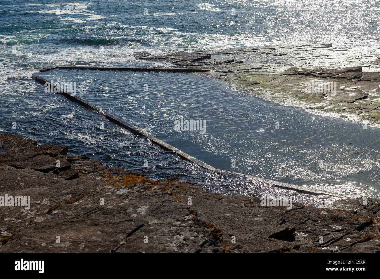 Waves at the wall of The Trinkie an outside swimming pool near Wick ...