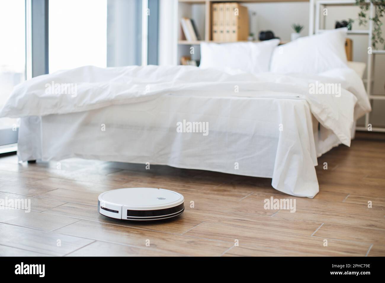 Efficient robotic vacuum cleaner removing dust from hard flooring ...