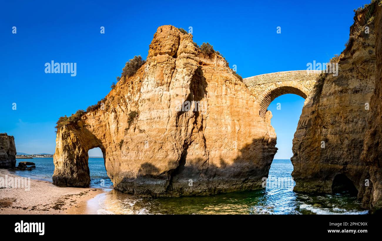 Low angle view of the ruins of ancient roman footbridge Ponte Romana de ...