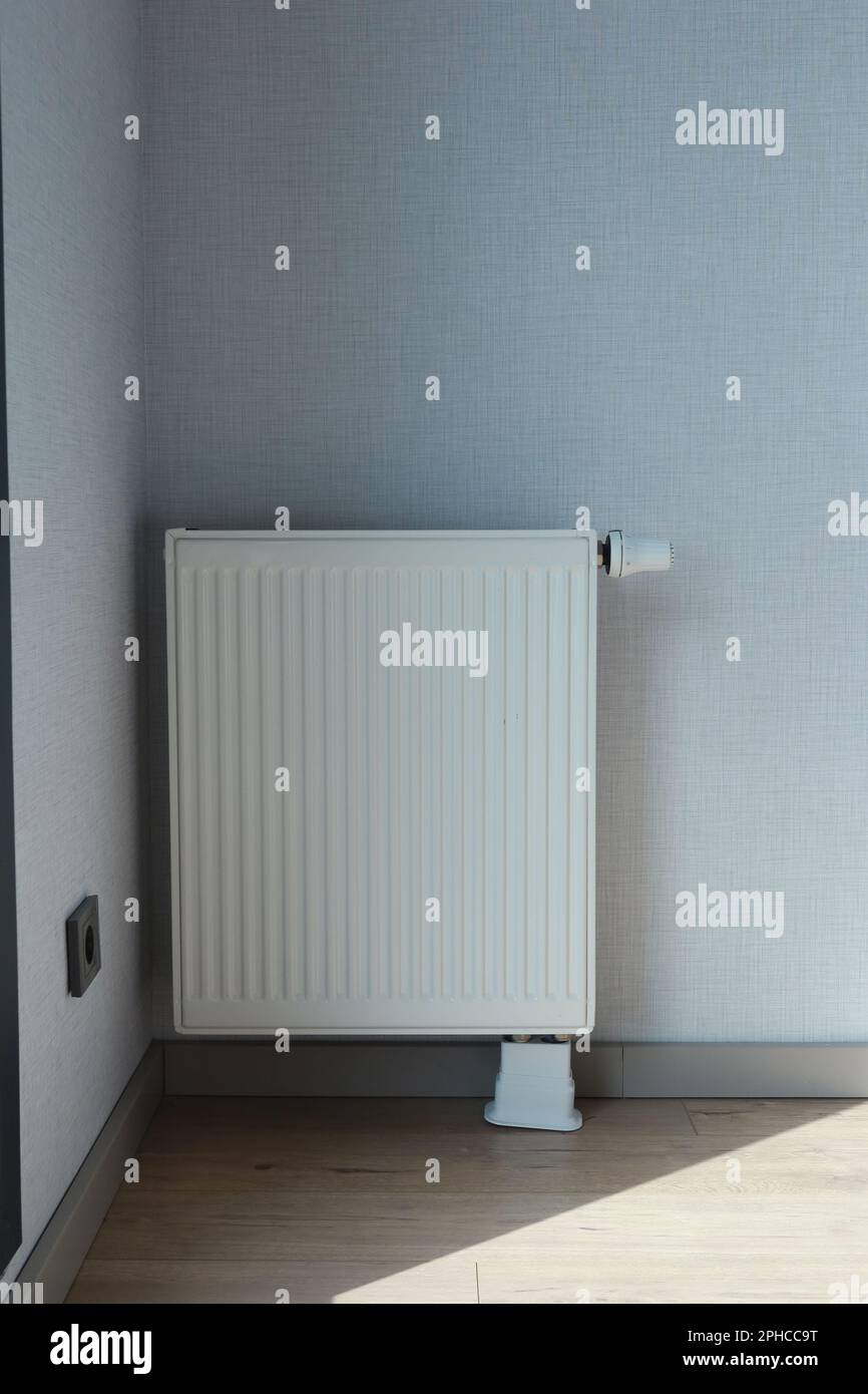 heating radiator under window in the room Stock Photo - Alamy
