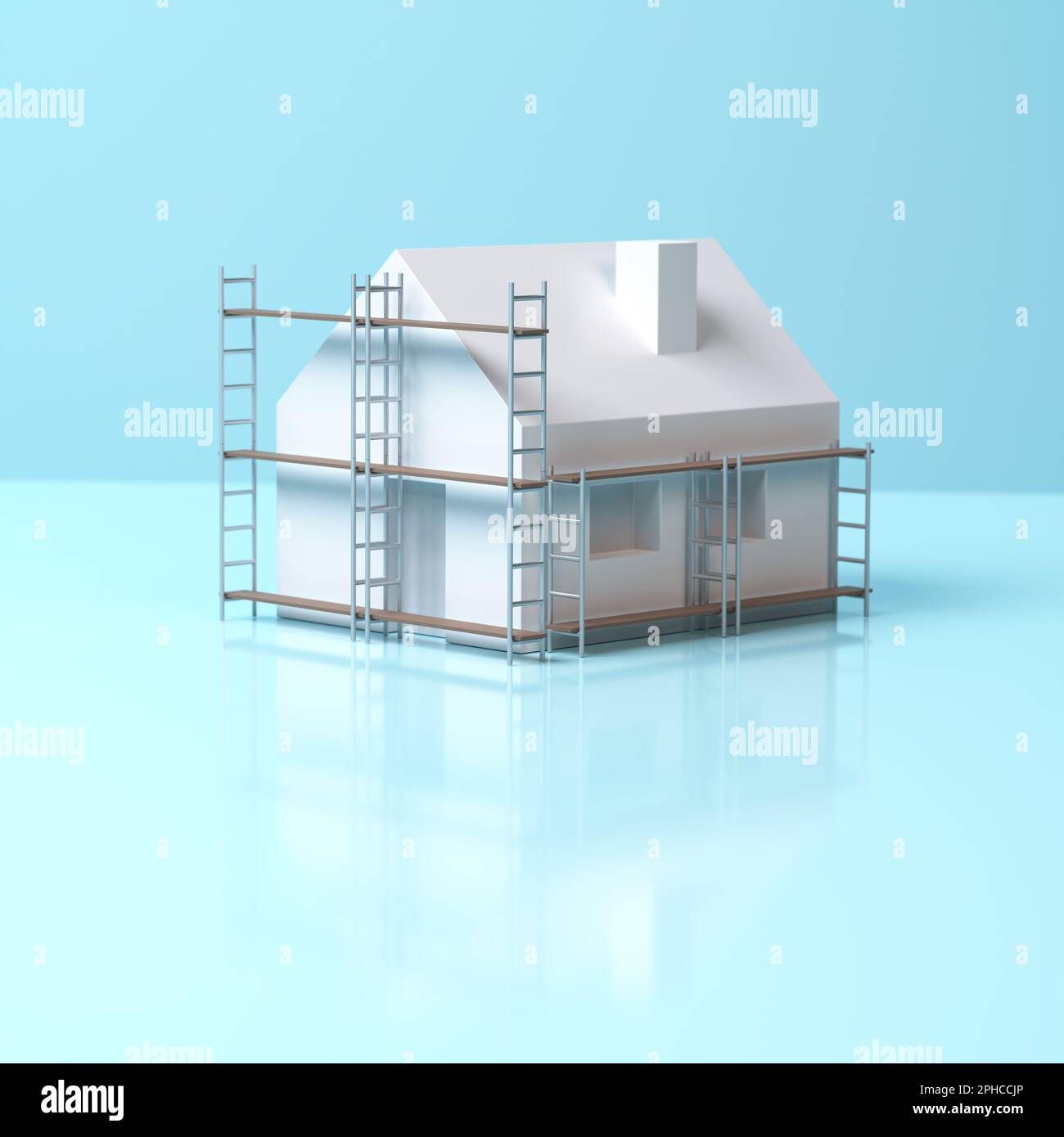 Model of a house with scaffolding. Renovation concept Stock Photo - Alamy