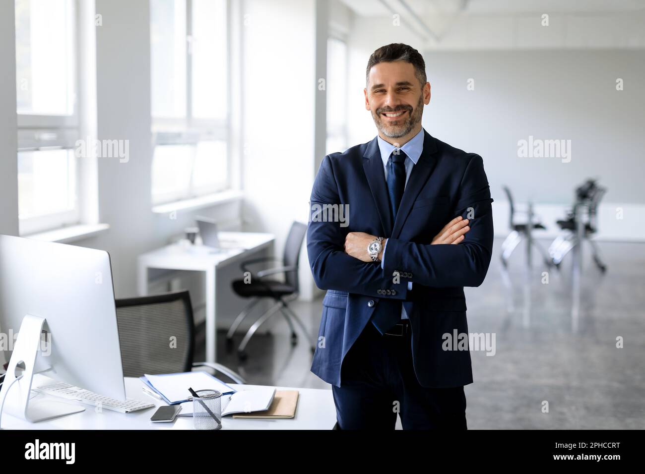 Successful business person. Portrait of male entrepreneur standing in ...