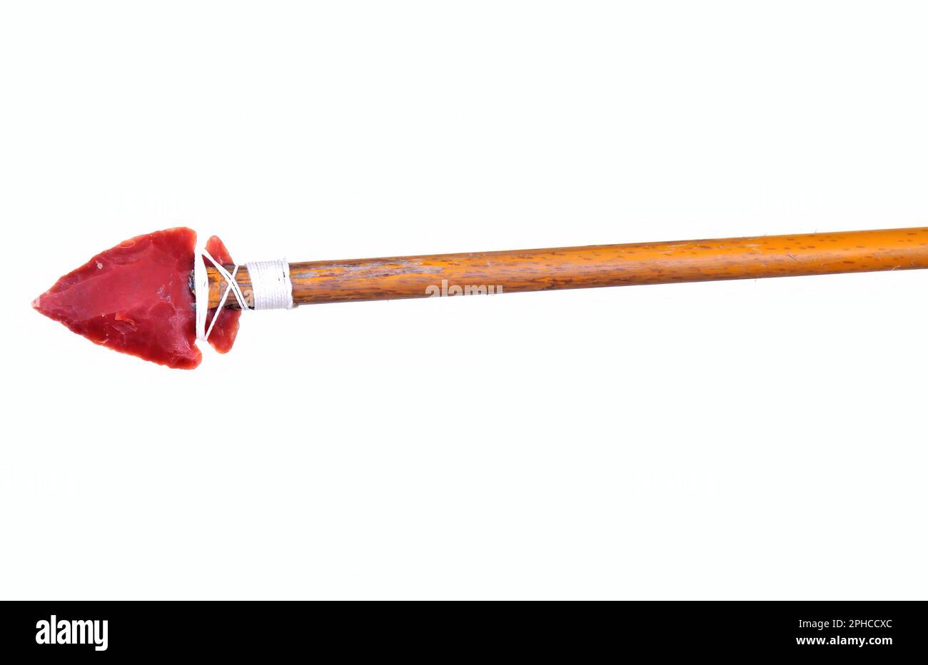 Handmade stone flint Arrow point on shaft with sinew isolated over a ...