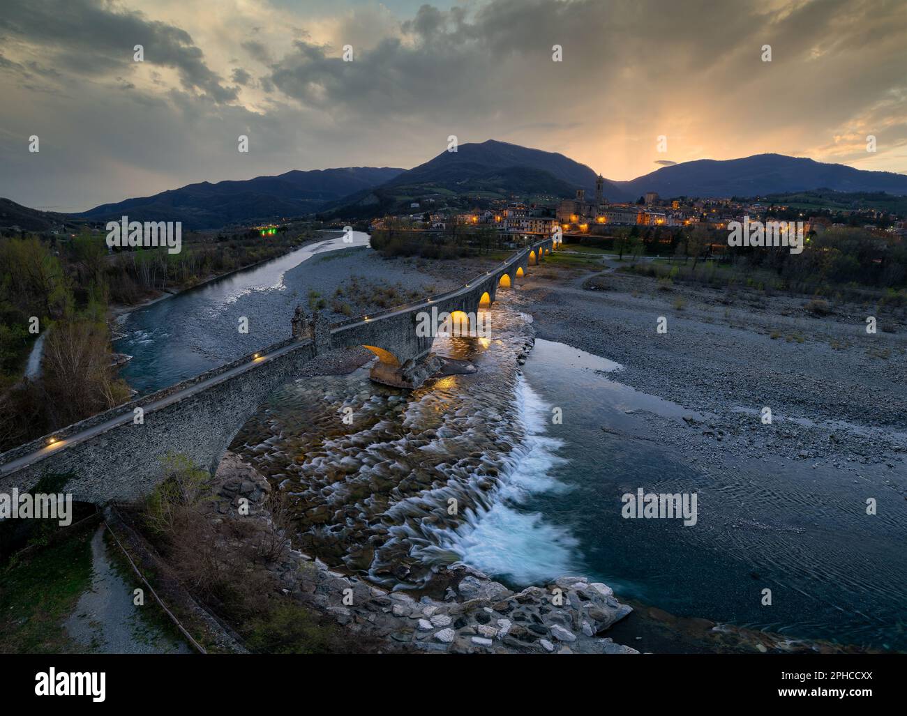 Nocturnal aerial view of the old medieval bridge, called "Ponte del ...