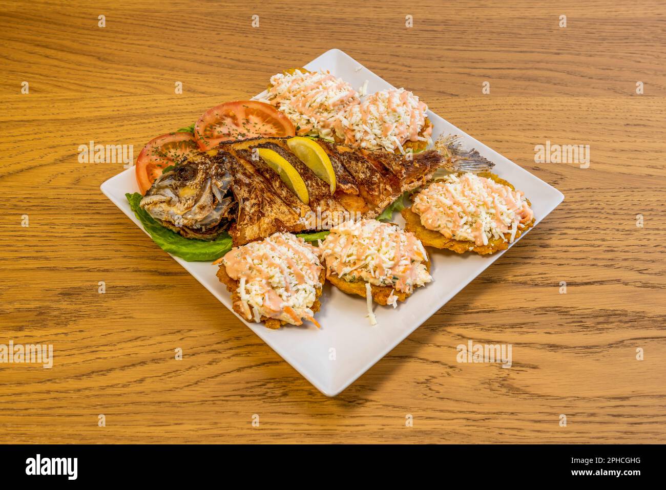 Fried fish usually accompanies whole fish, in pieces or filleted with ...