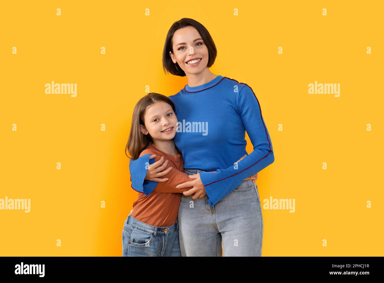 Mothers Love Concept Portrait Of Happy Young Mom Embracing Her