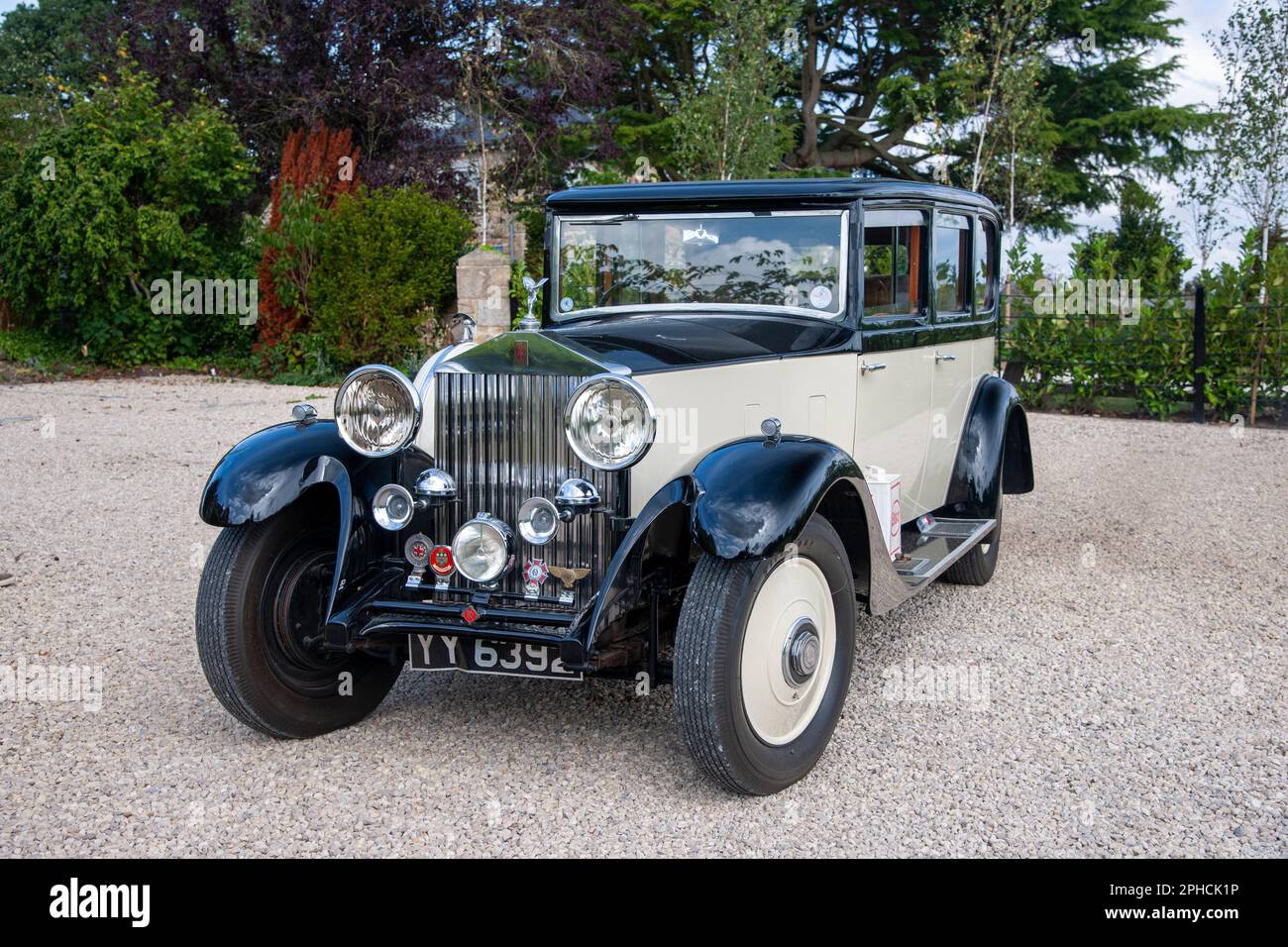1932 Rolls-Royce 20/25 parked on a gravel drive with trees and garden ...