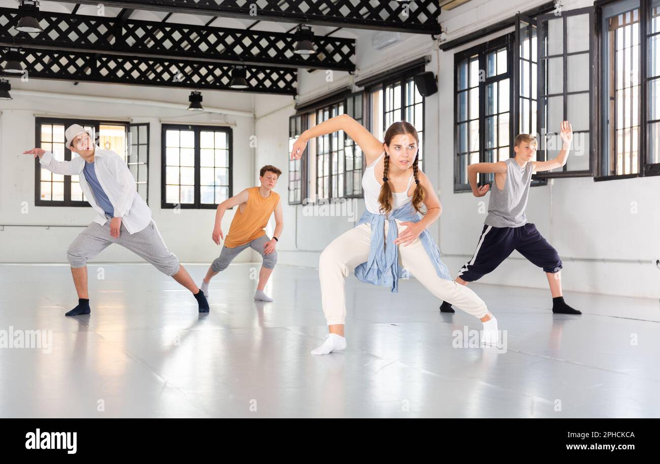 Group of young artists performing street dance Stock Photo - Alamy