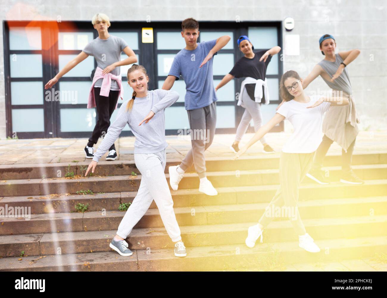 Group of teenagers performing street dance outdoors Stock Photo - Alamy