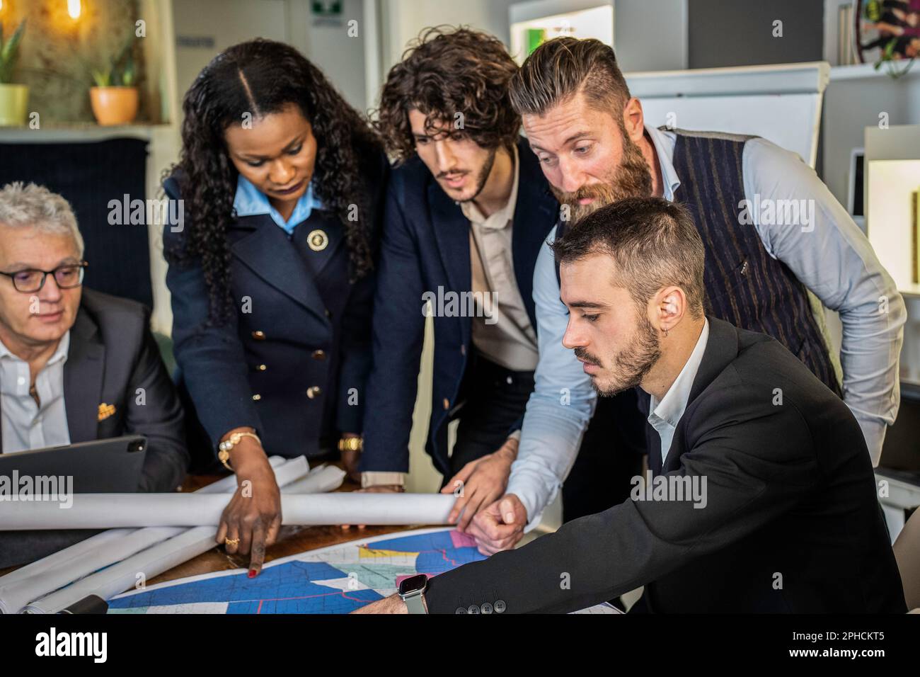 Multicultural business people working together on sustainable ...