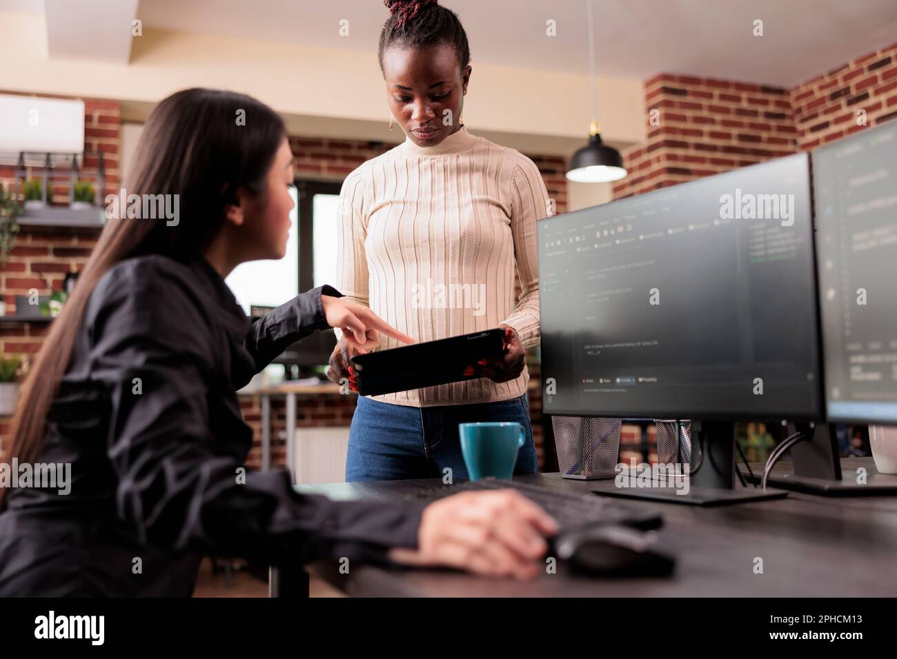 System engineers comparing source hi-res stock photography and images ...