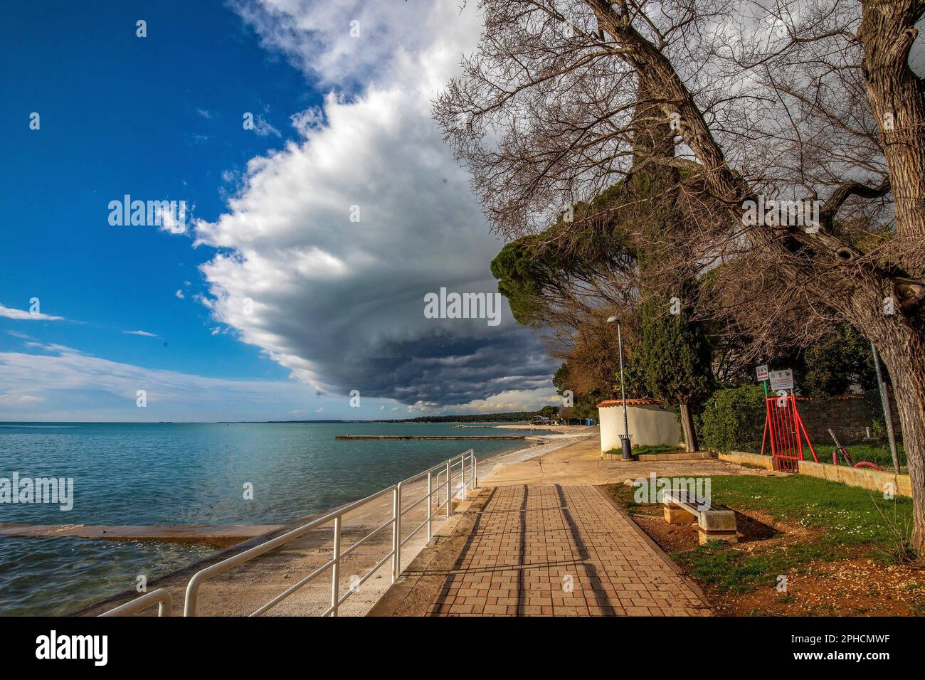 Dark rainy clouds seen above Fazana, in Fazana, Croatia, on march, 27 ...