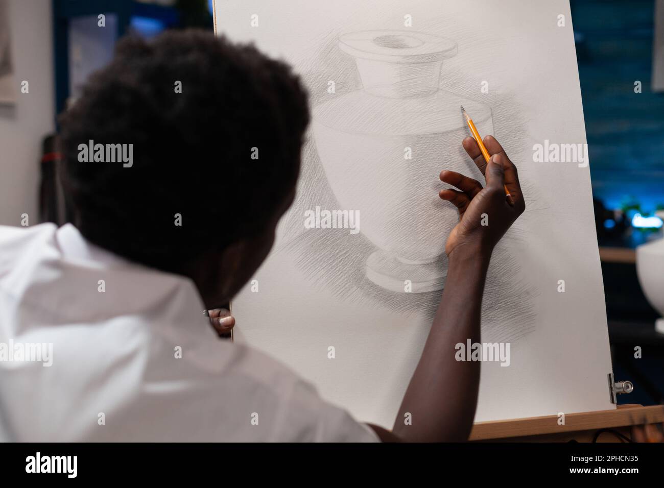 Close up of artwork of african american man drawing with pencil on ...