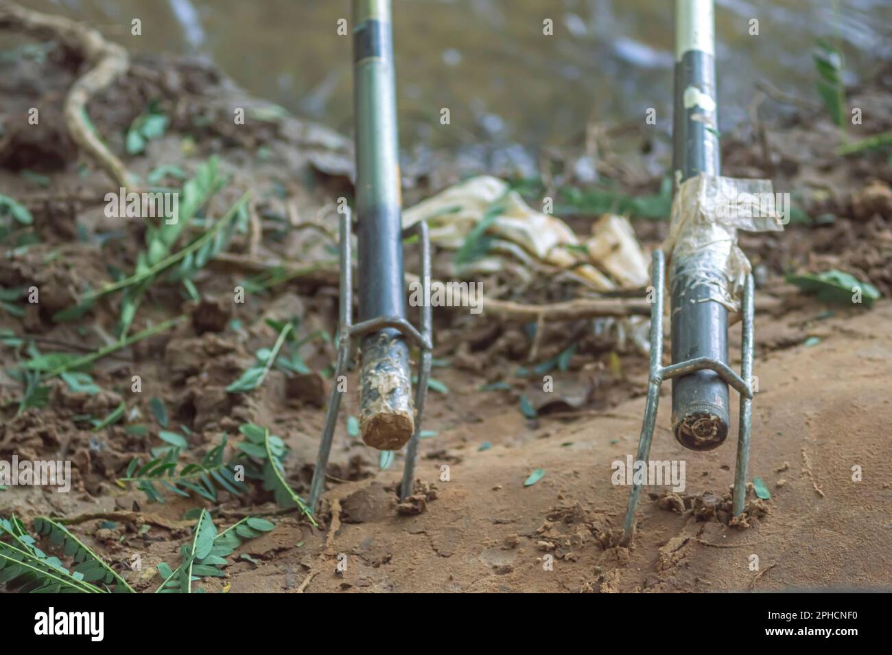 Fishing rods stuck in the support on the edge of a river,fishing ...