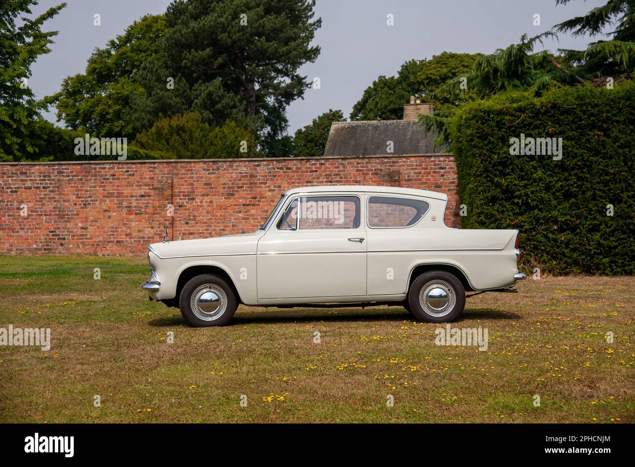 Ford Angial 1200 Delux two door saloon parked on grass in a walled ...