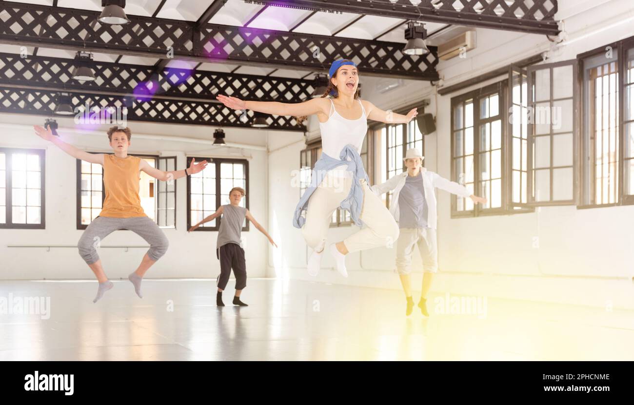 Teenage dancers jumping together during workout Stock Photo - Alamy