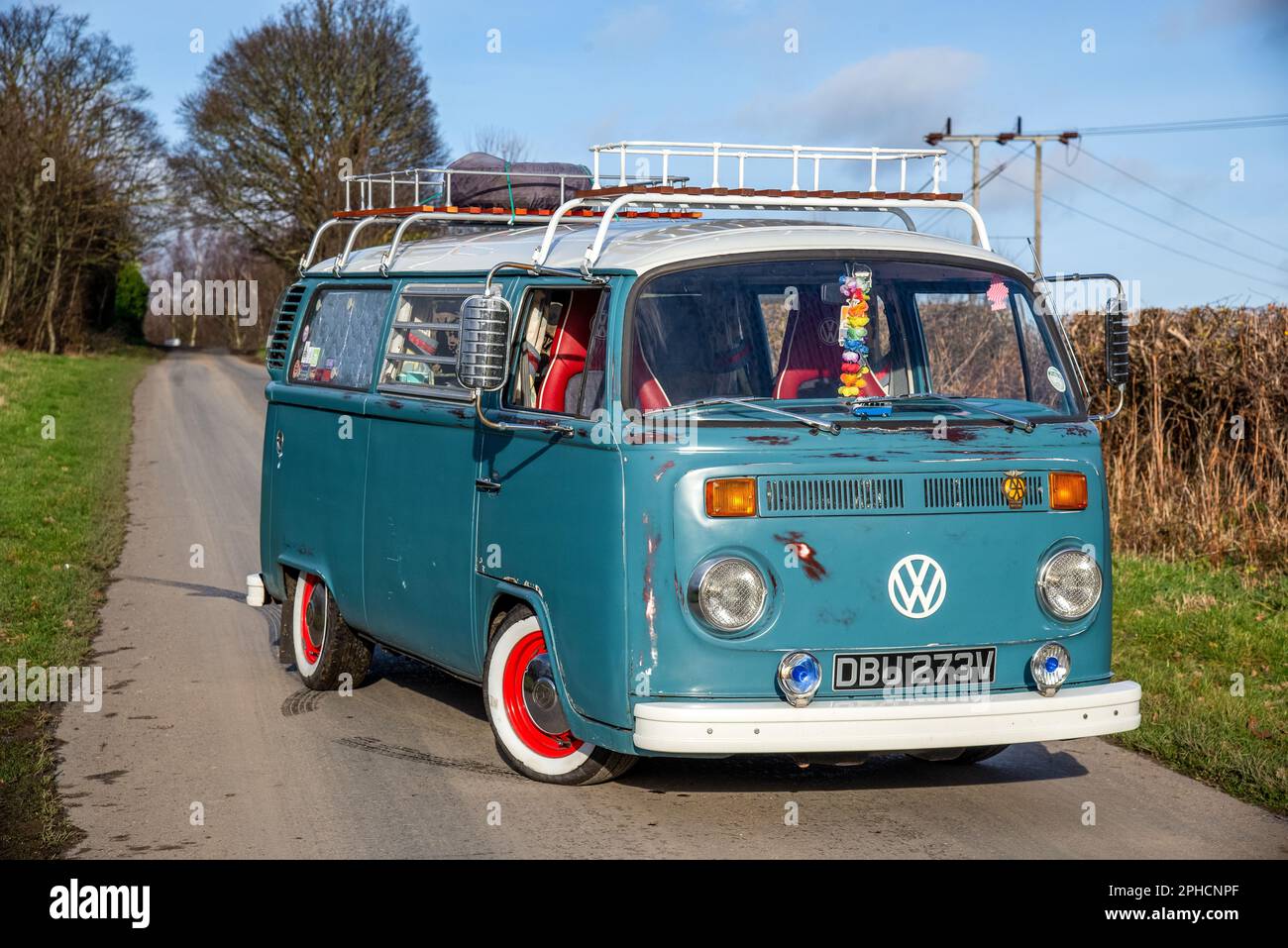 Volkswagen 'Bay Window' camper van parked on a country lane near Hoober ...