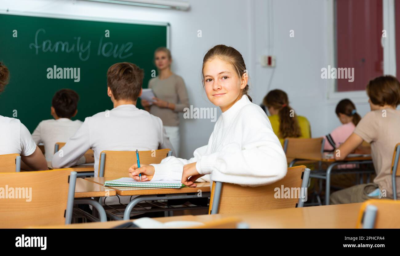 Teenage schoolgirl in classroom during lesson Stock Photo - Alamy