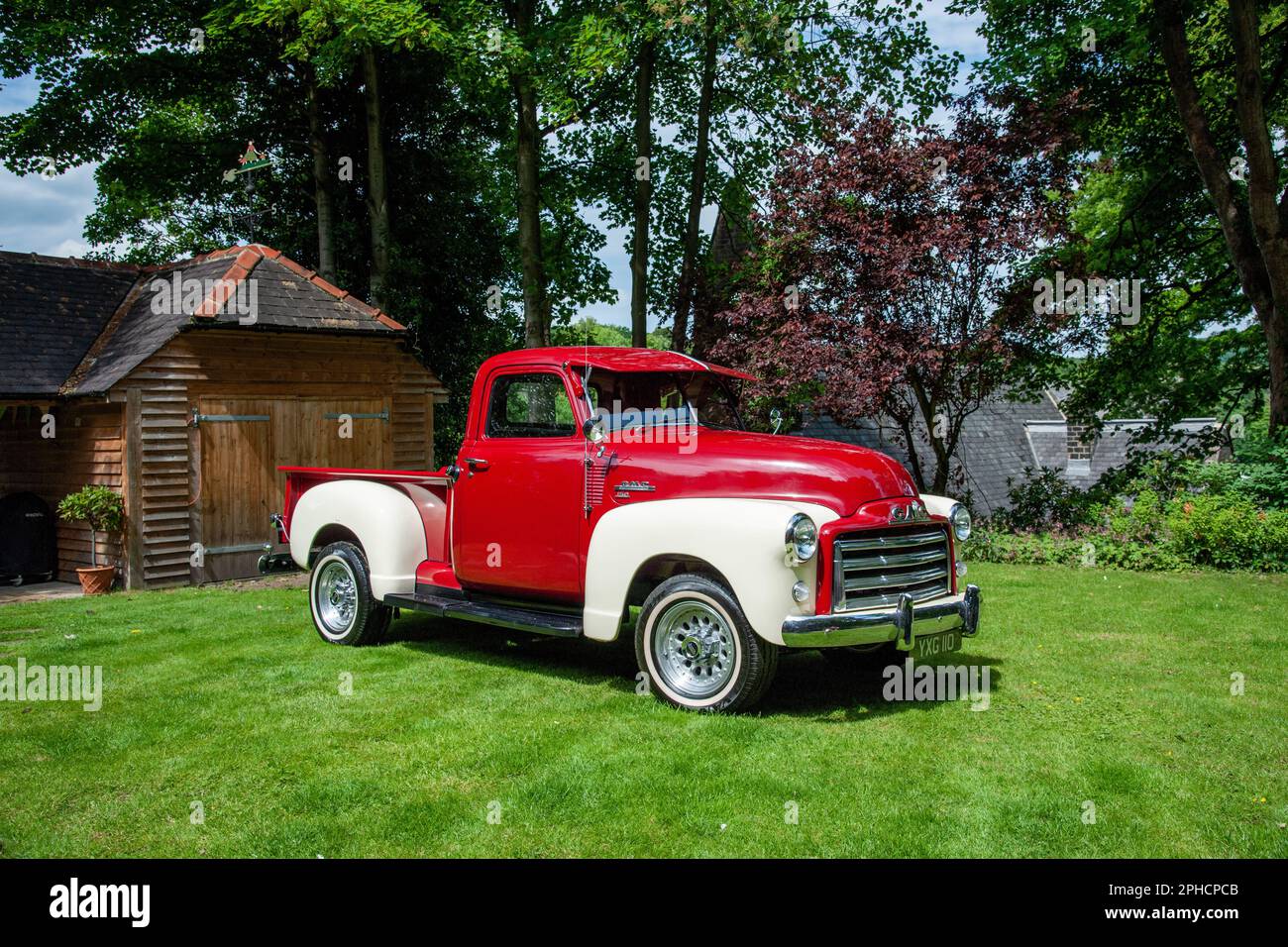 Red 1949 GMC American pick-up truck parked on grass on a summer day ...