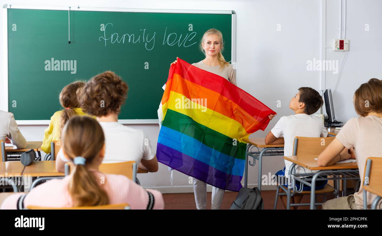 Teacher explaining lgbt theme to children during lesson Stock Photo - Alamy